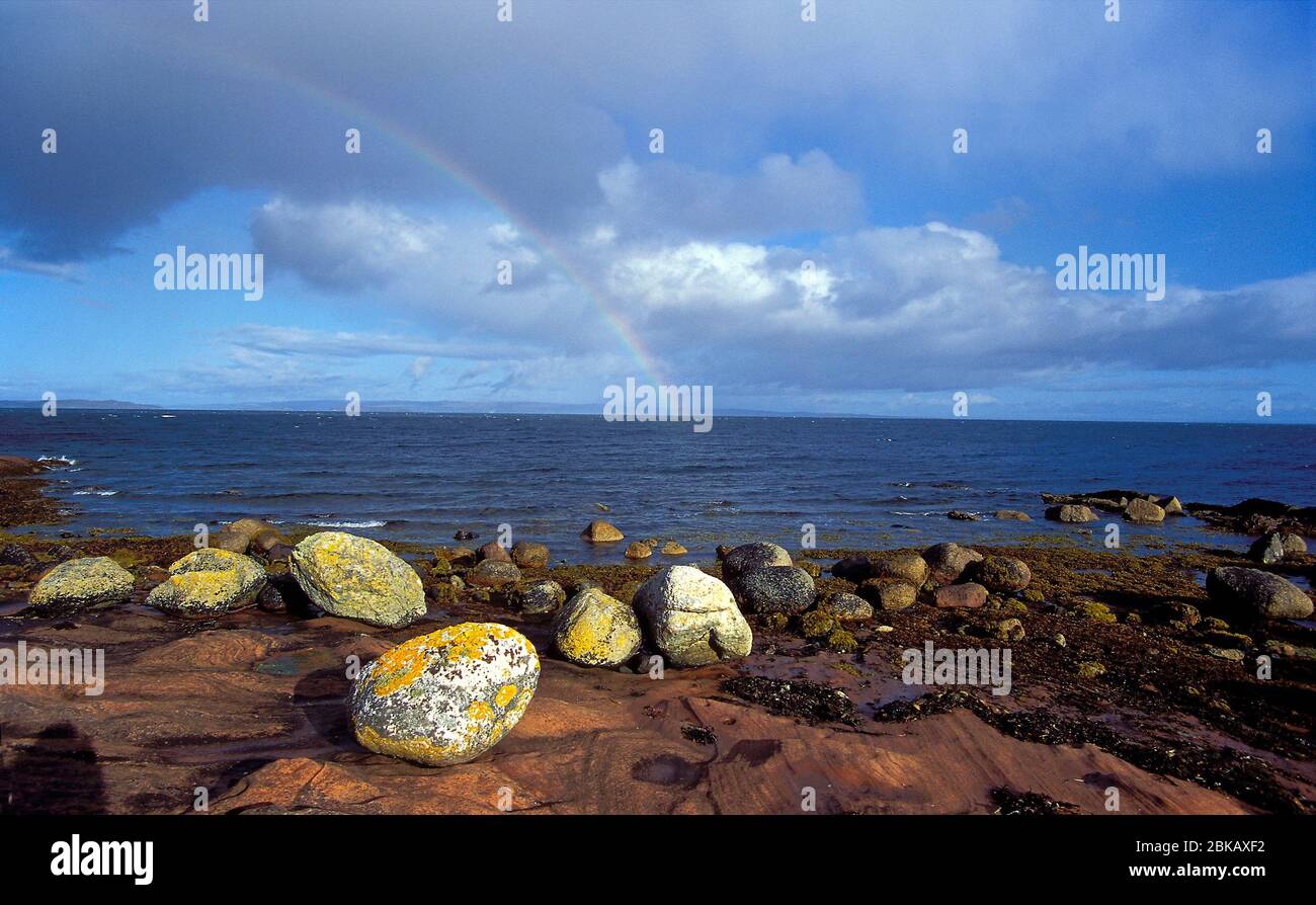 corrie shore with boulders and rainbow Stock Photo - Alamy