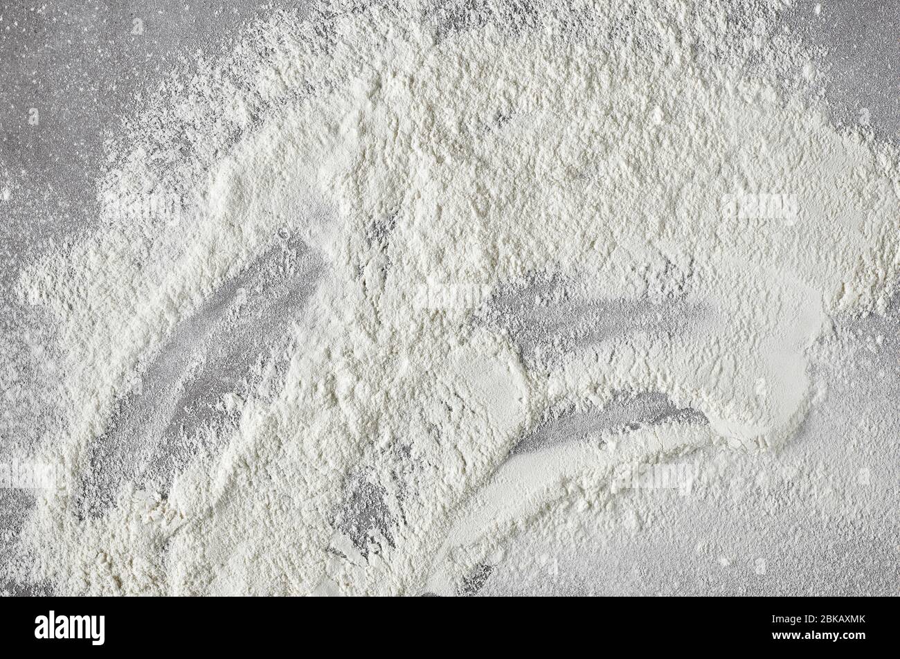 white flour texture on grey kitchen table background, top view Stock ...