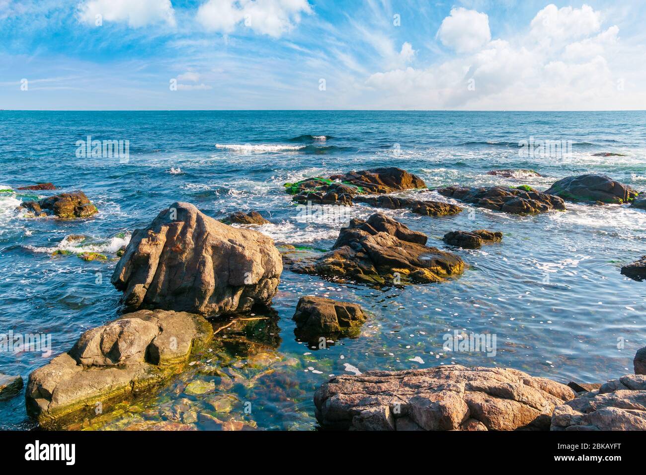 rocky shoreline of the sea in the morning. beautiful scenery with ...