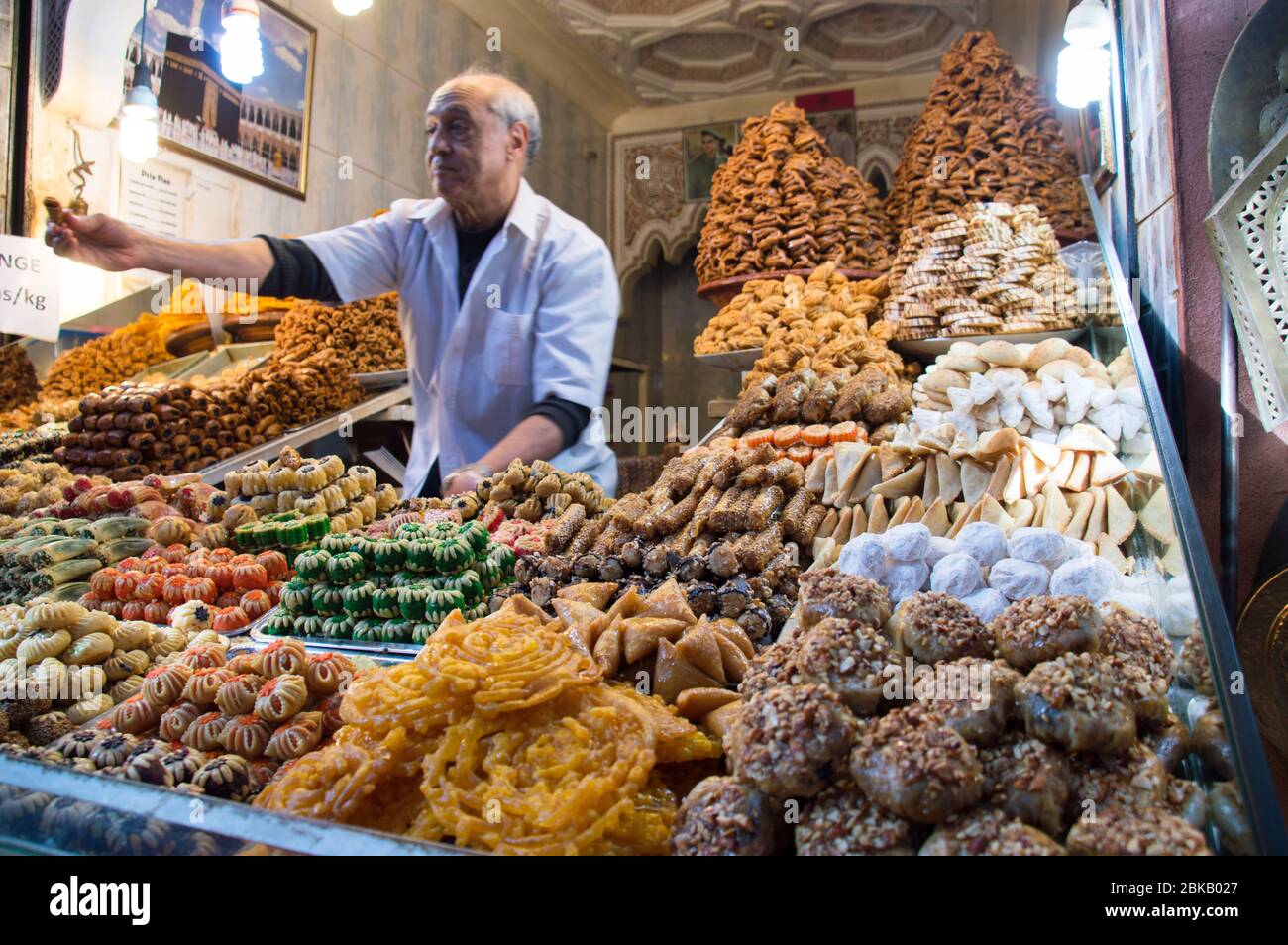 Moroccan sweet and Pastry vendor in Marrakesh market with multi-colored ...