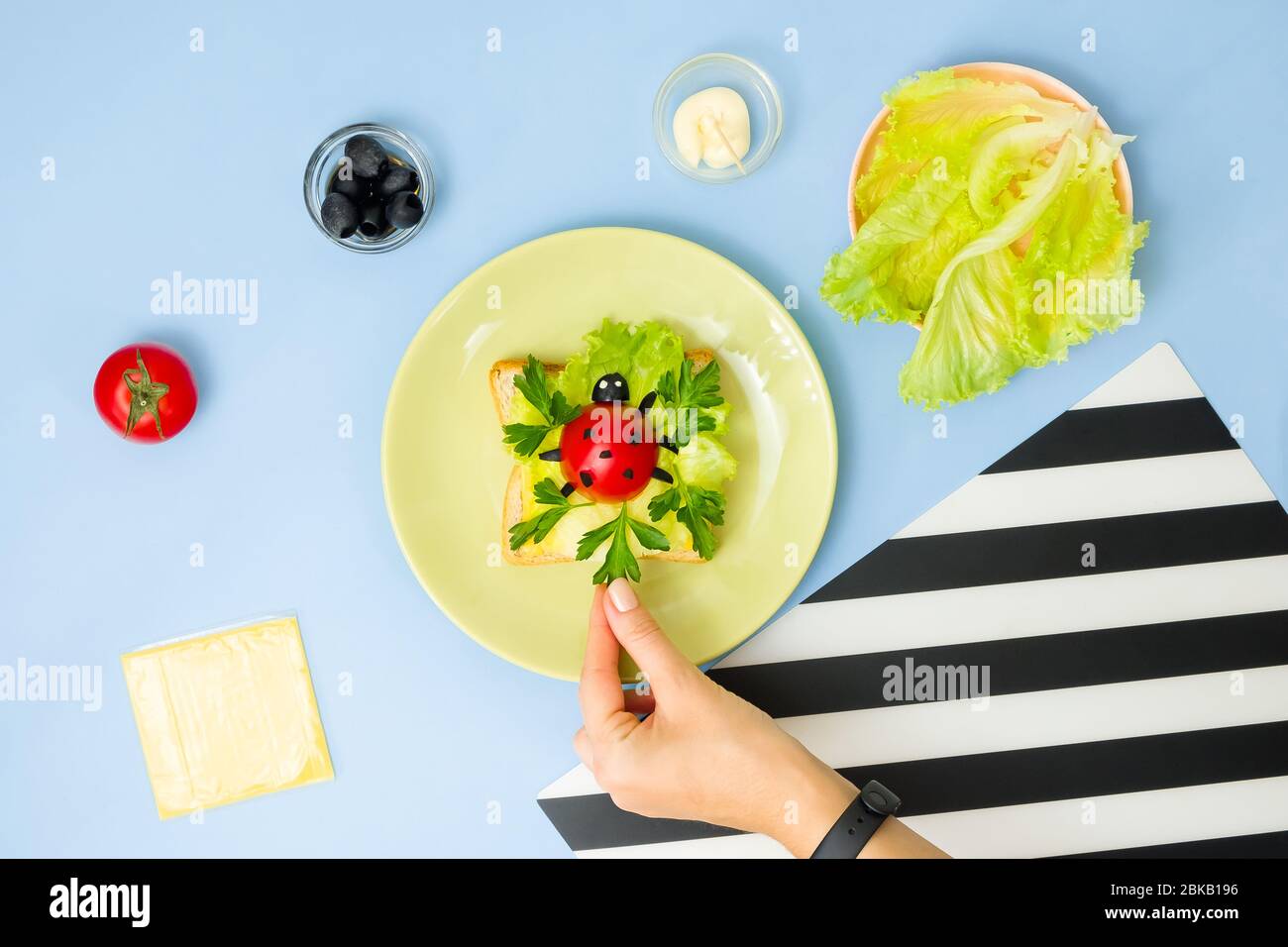 Fun food art for kids. Ladybug sandwich on blue background. How to make ...
