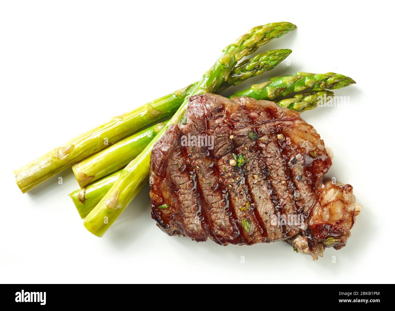 grilled steak and asparagus isolated on white background, top view ...