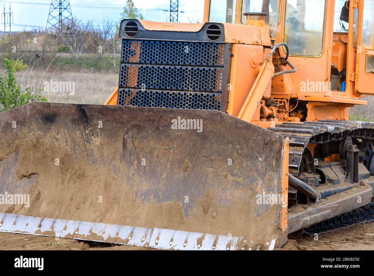 Industrial building construction site bulldozer leveling and moving ...