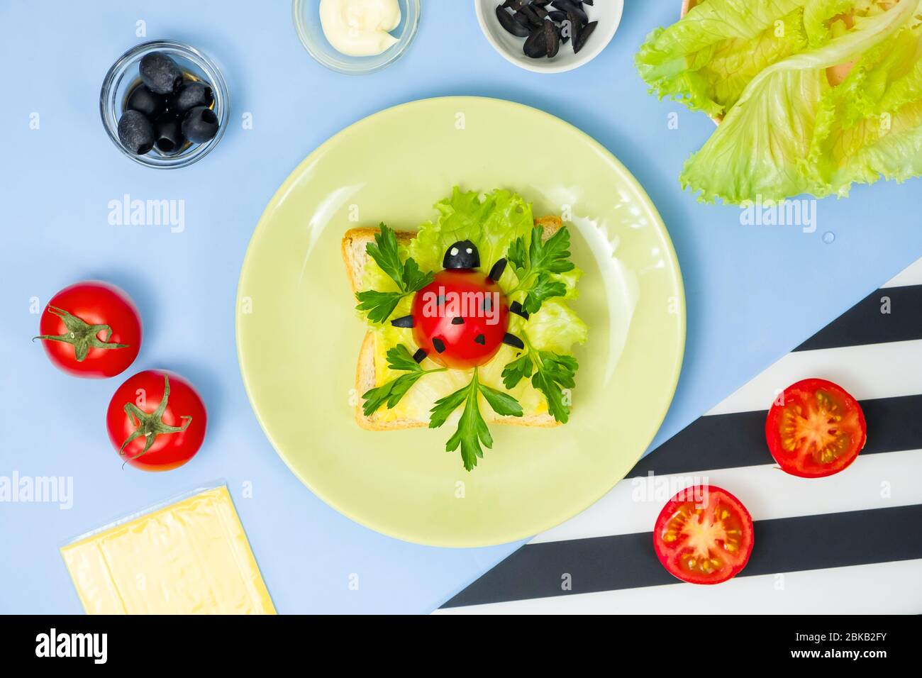 Fun food art for kids. Ladybug sandwich on blue background. How to make ...