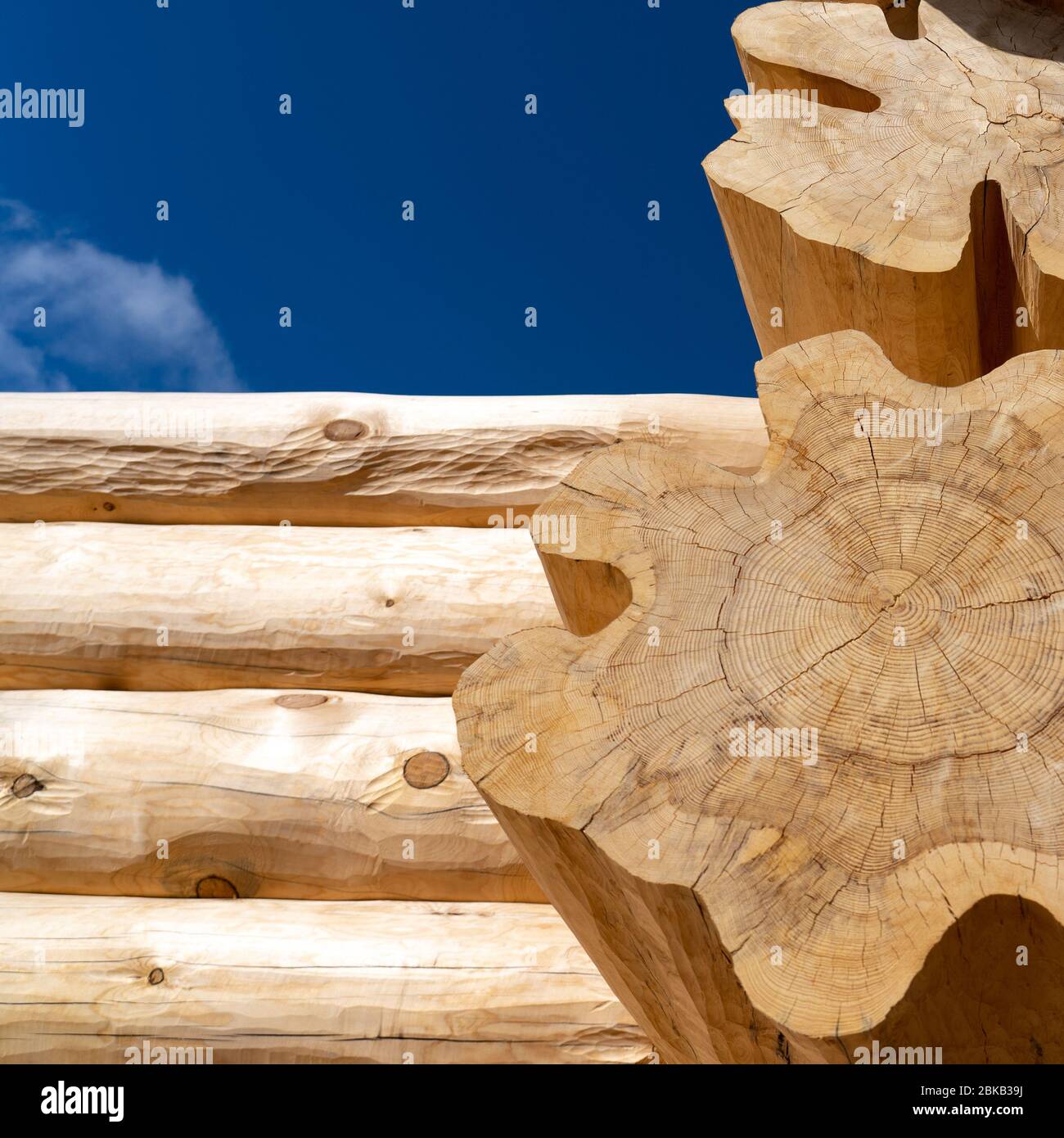 Making ethnic log houses in the open Stock Photo - Alamy