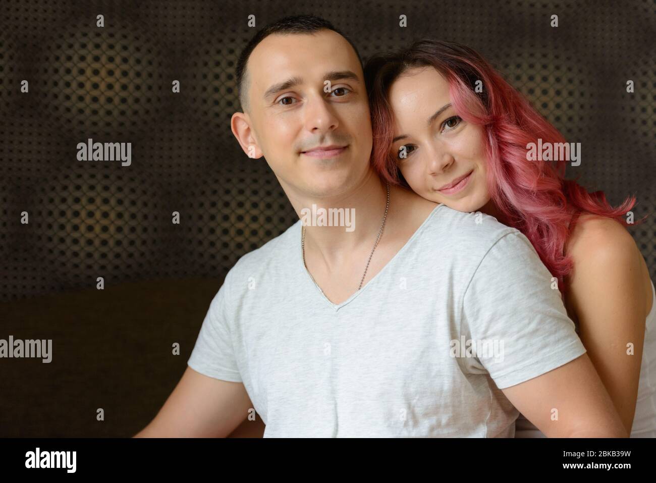 Portrait of couple together and in love against abstract background ...