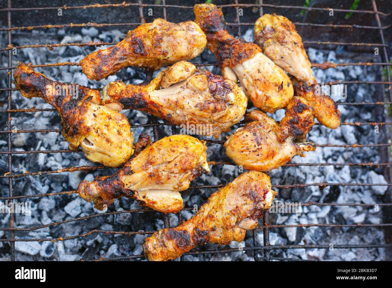 grilled chicken legs on the grill top view Stock Photo - Alamy