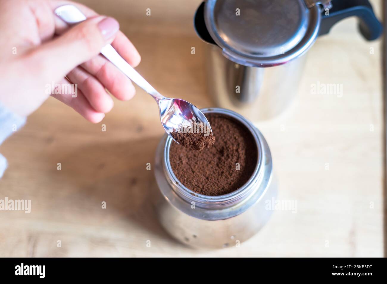 Preparing coffee: Close up of coffee powder in a vintage coffee cooker ...