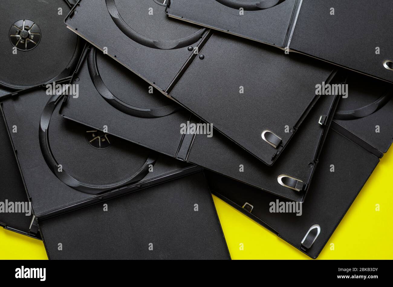 Empty black box dvd background. A pile of open plastic boxes for cd ...