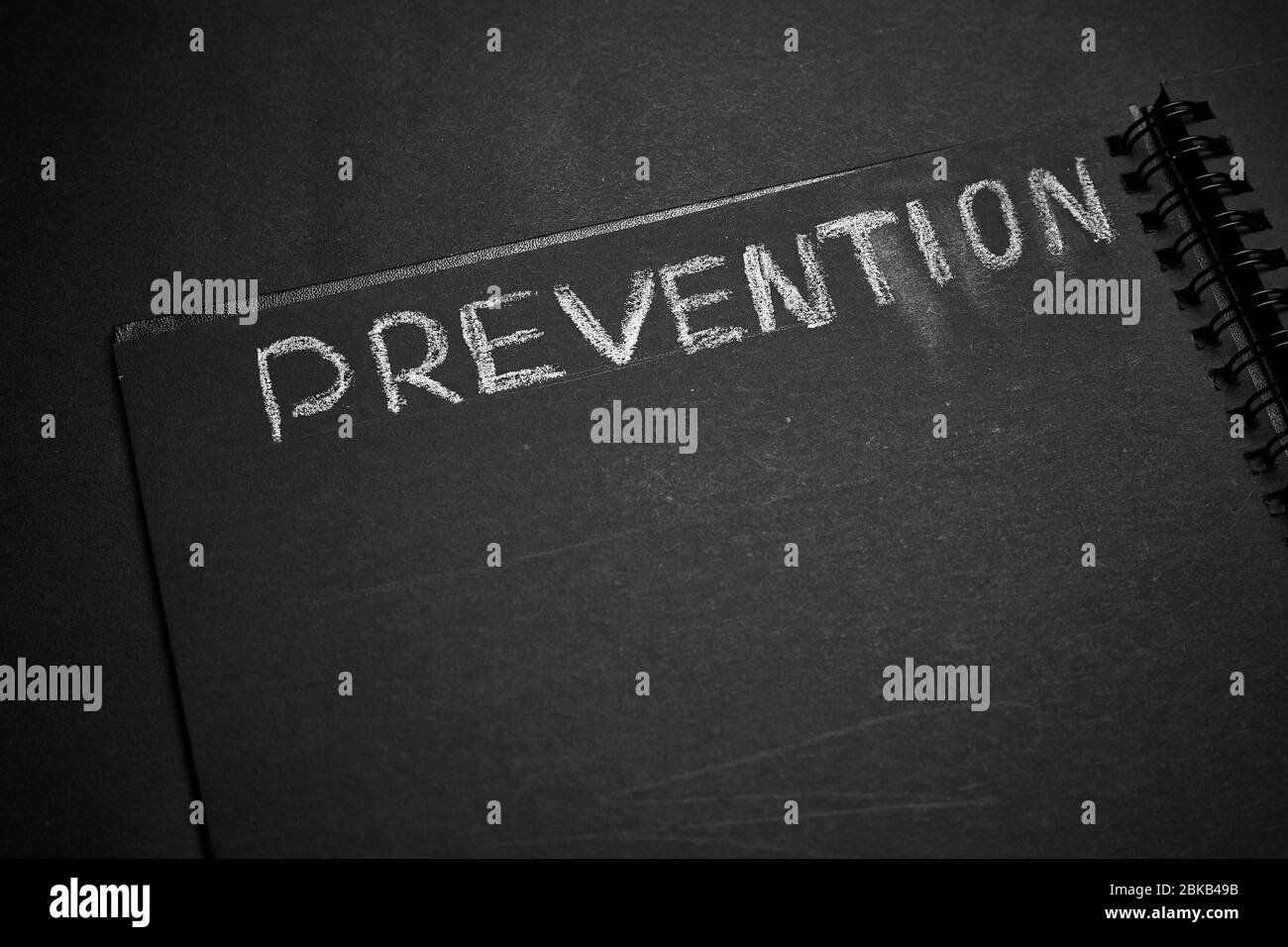 Prevention word written on a notepad with blank space. Blank black ...