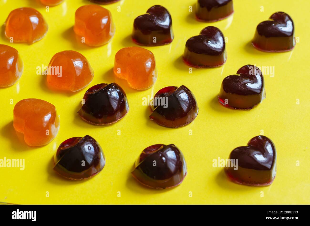 Homemade gelatin candies on a yellow background. Jelly candies with ...