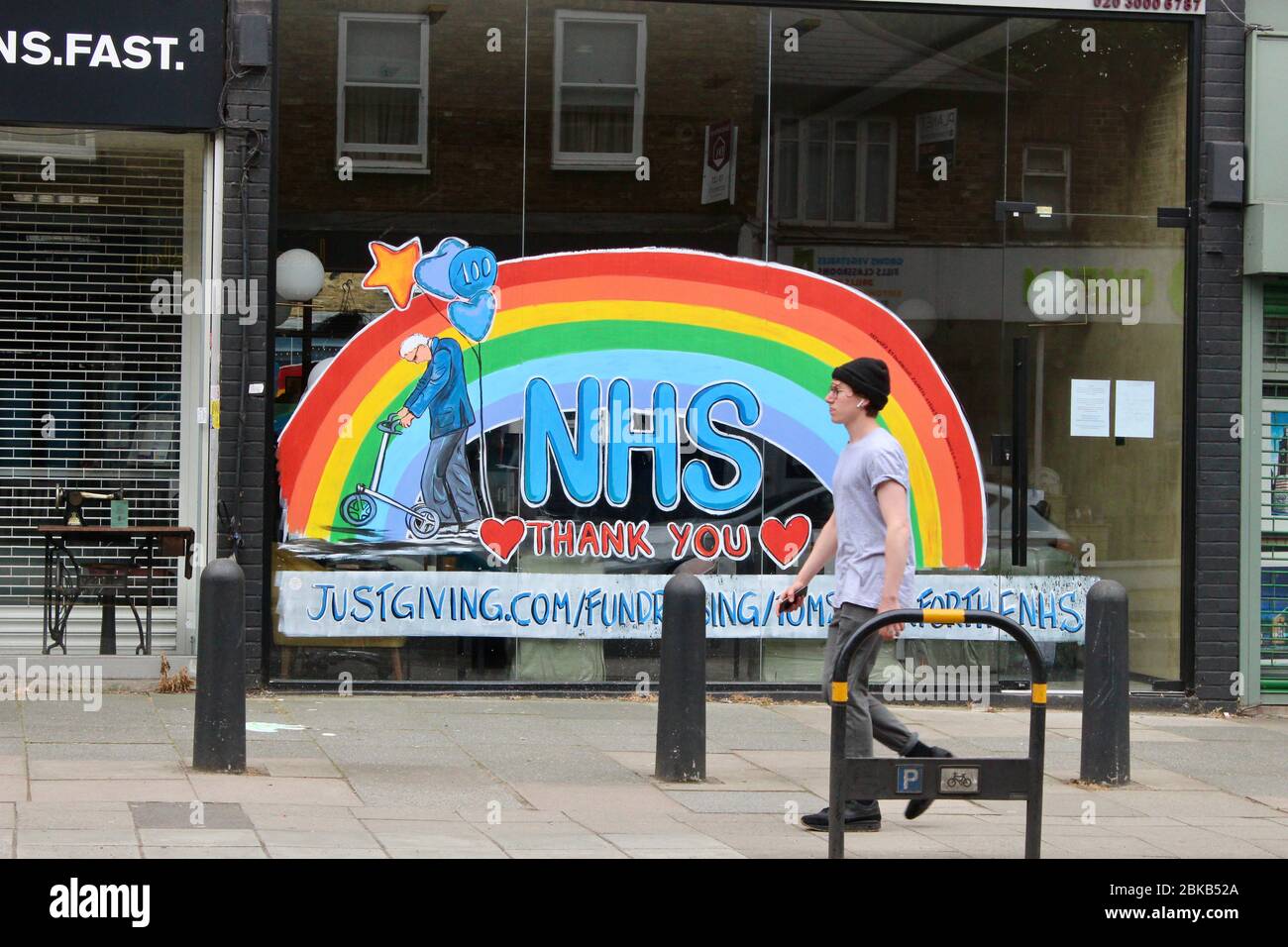 a shop window display thanks the NHS and promotes captain tom just ...