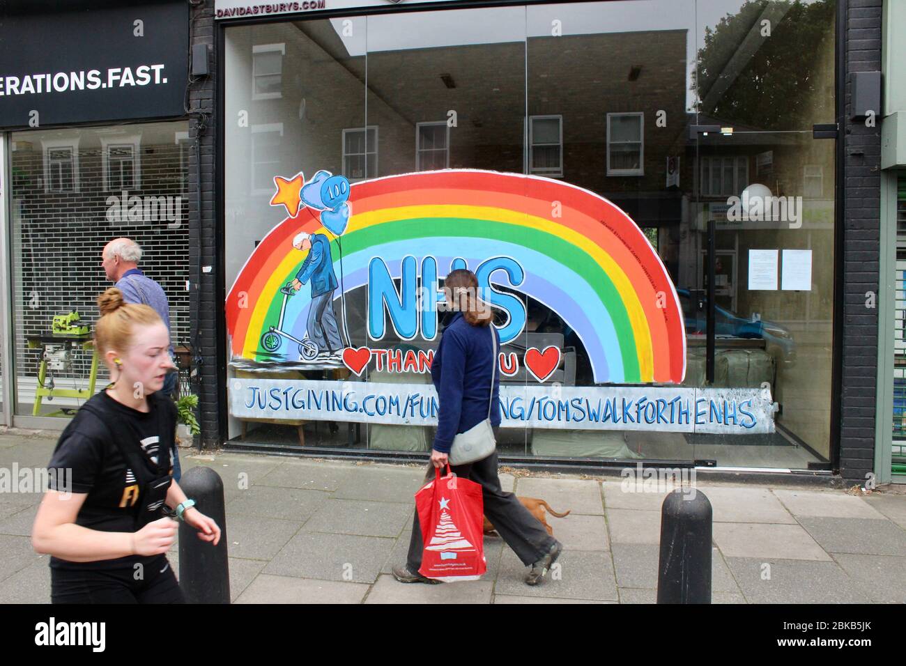 a shop window display thanks the NHS and promotes captain tom just ...