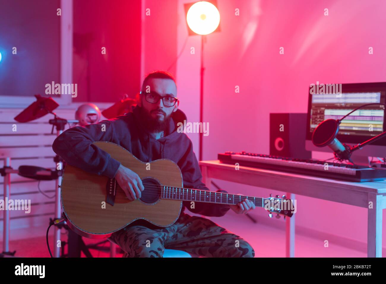 Create music and a recording studio concept - Bearded man guitarist ...