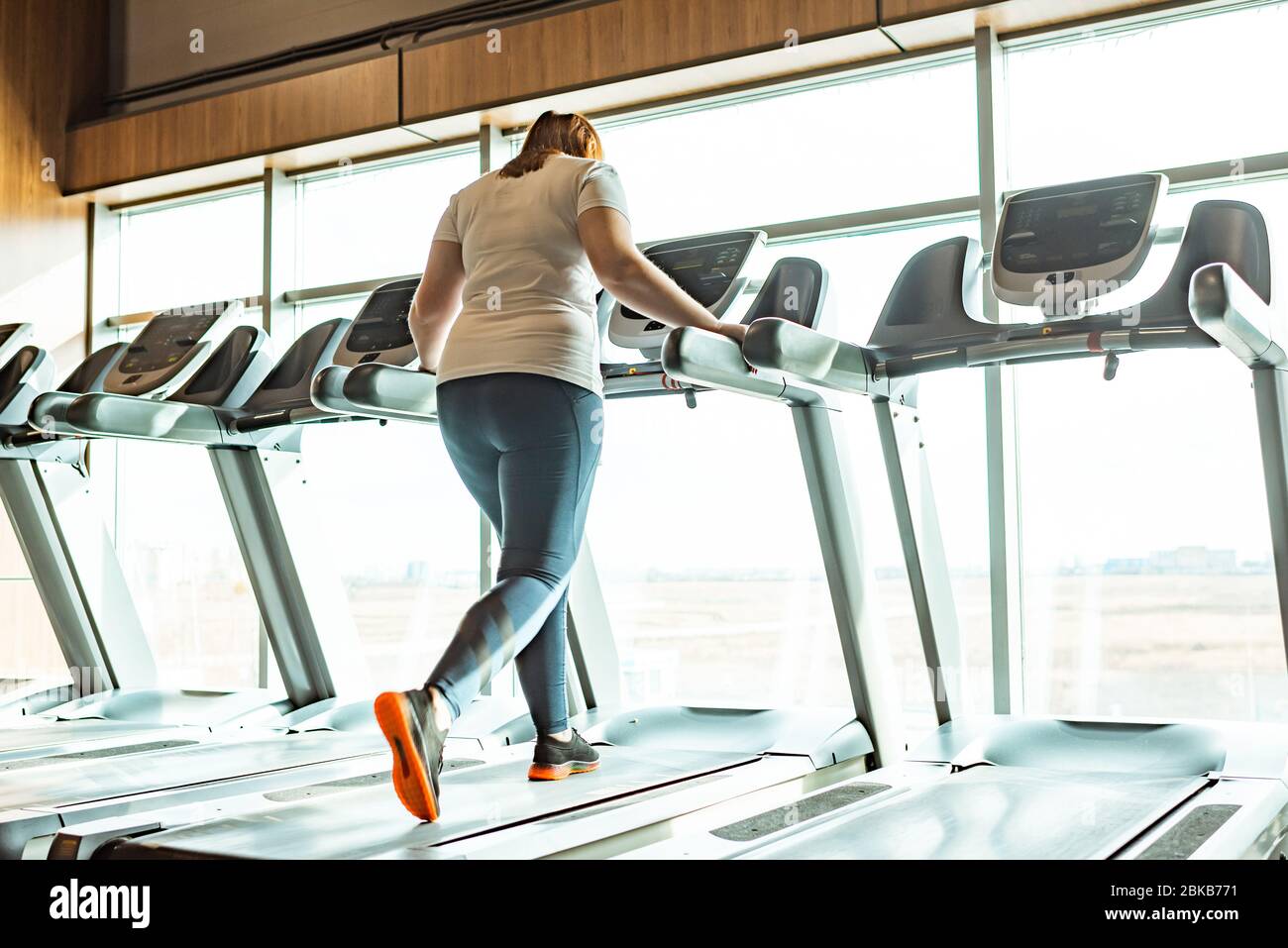 Back view girl on treadmill hi-res stock photography and images - Alamy