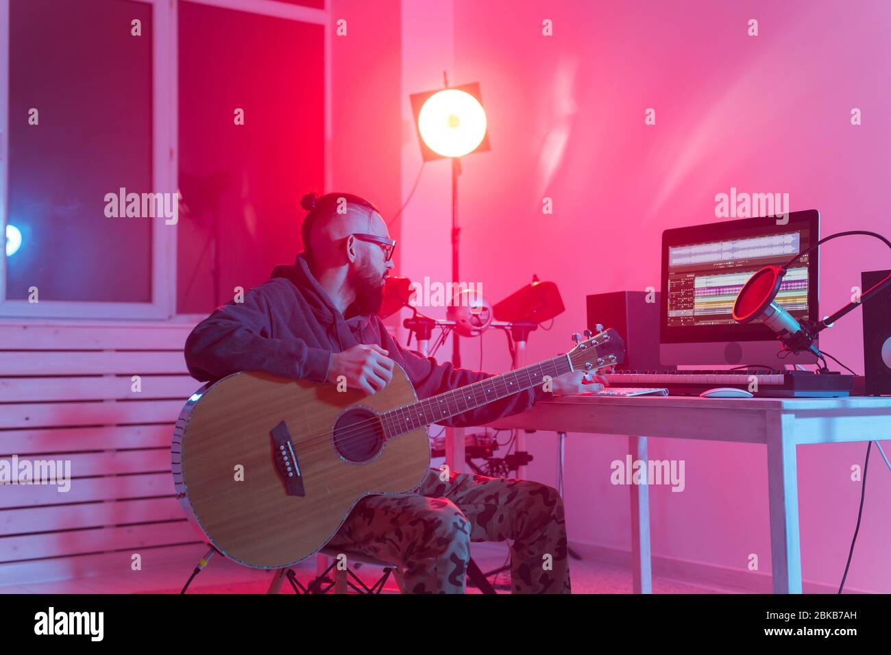 Create music and a recording studio concept - Bearded man guitarist ...