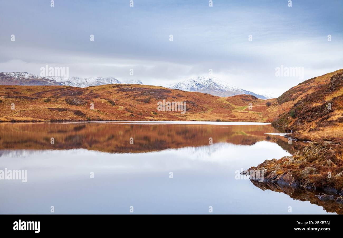 Beacon Tarn in the Blawith Fells with the snow covered "Old Man of ...