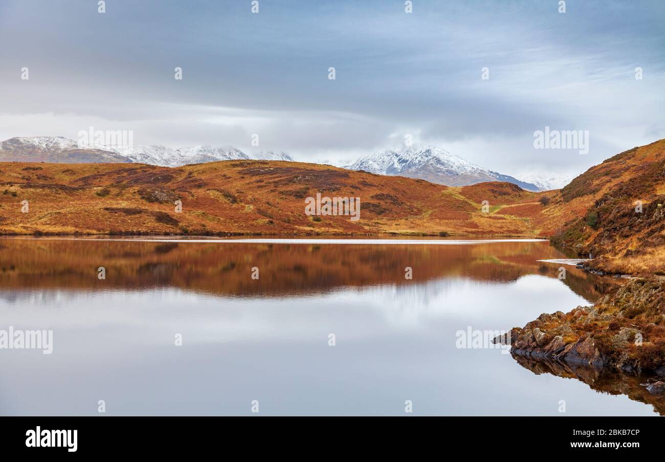 Beacon Tarn in the Blawith Fells with the snow covered "Old Man of ...