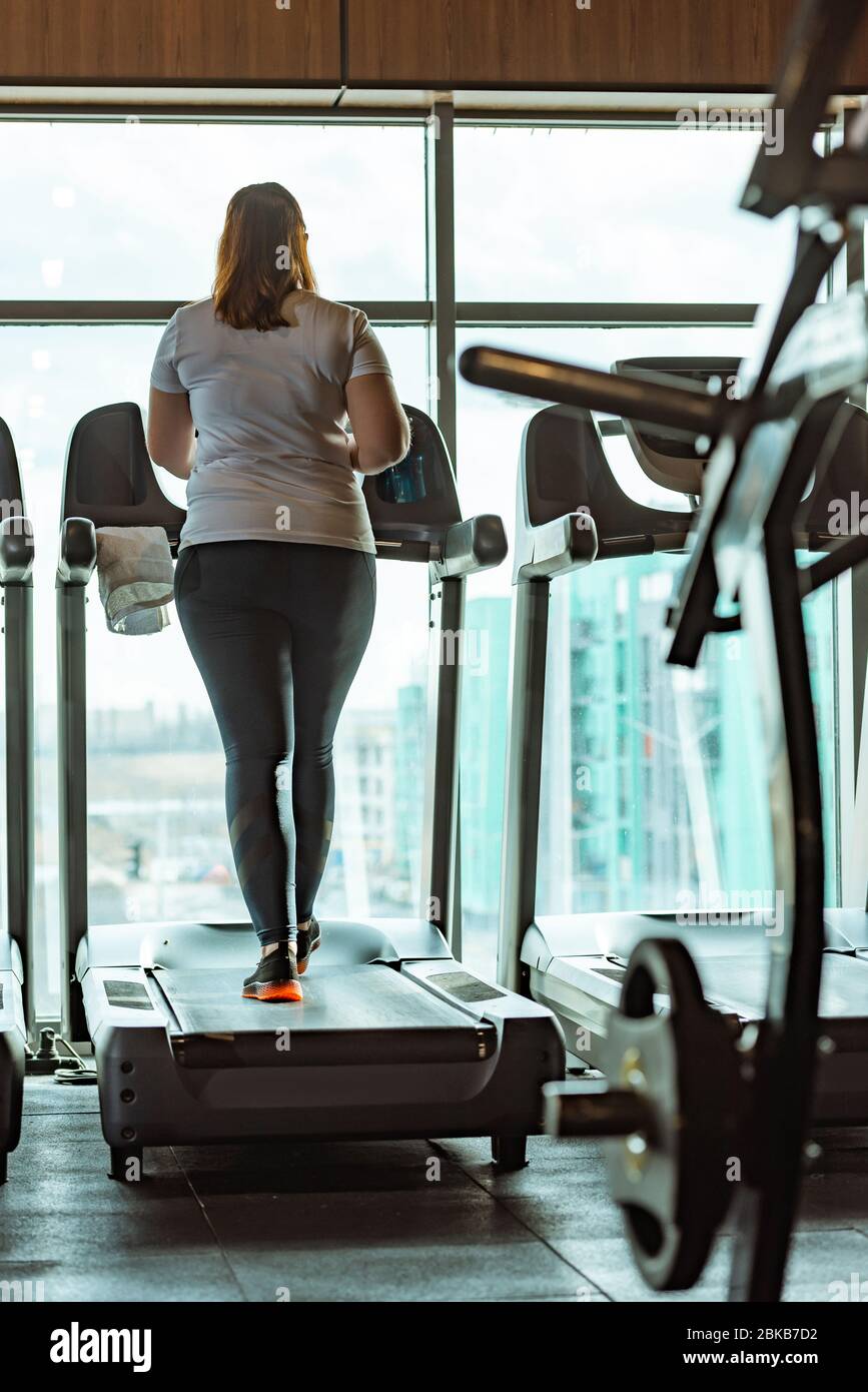 Back view girl on treadmill hi-res stock photography and images - Alamy