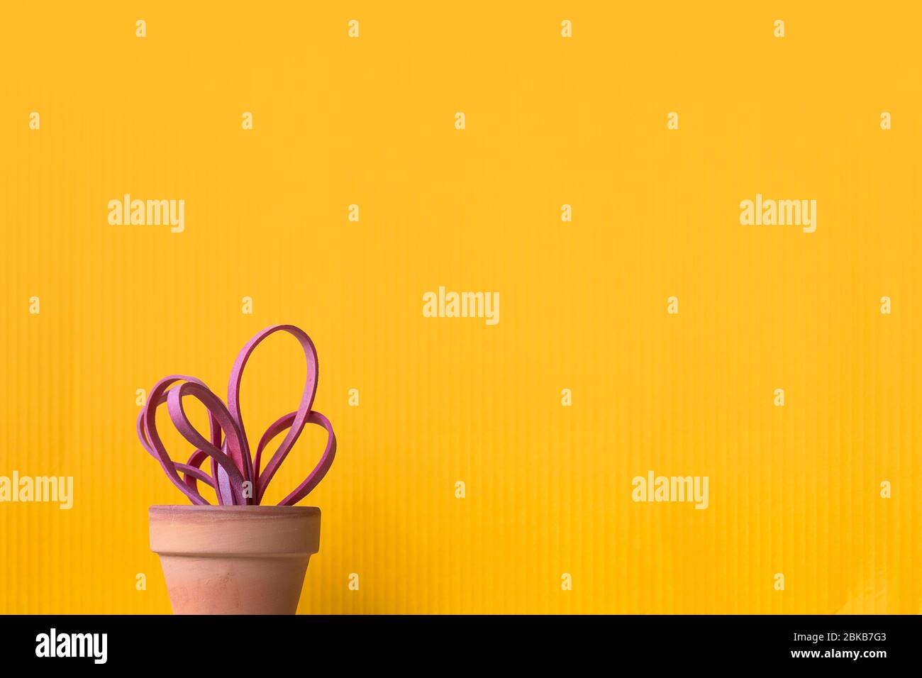 Rubber band ball on colored paper Stock Photo - Alamy