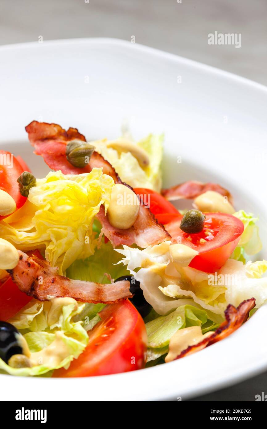 vegetable salad with bacon and capers Stock Photo - Alamy