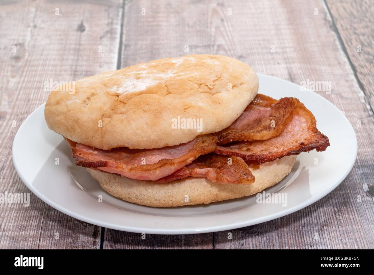 Bacon sandwich - wood table background Stock Photo - Alamy