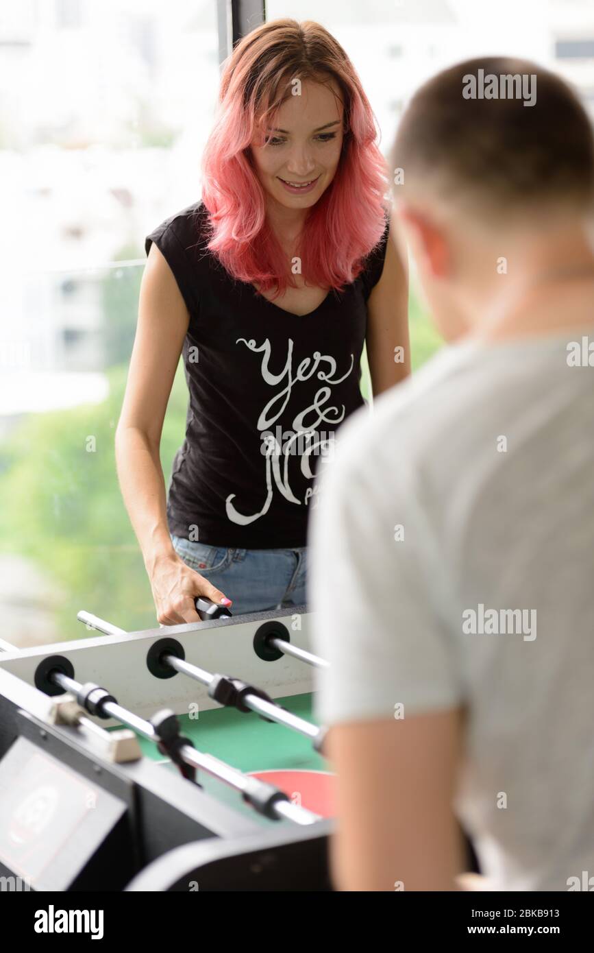 Portrait couple playing foosball hi-res stock photography and images ...
