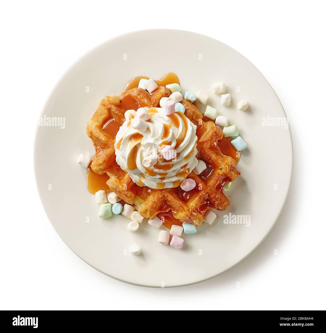 plate of freshly baked belgian waffle dessert with cream and ...