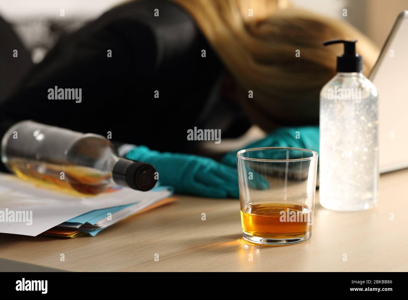 Close up of drunk entrepreneur woman sleeping on desk on covid-19 ...