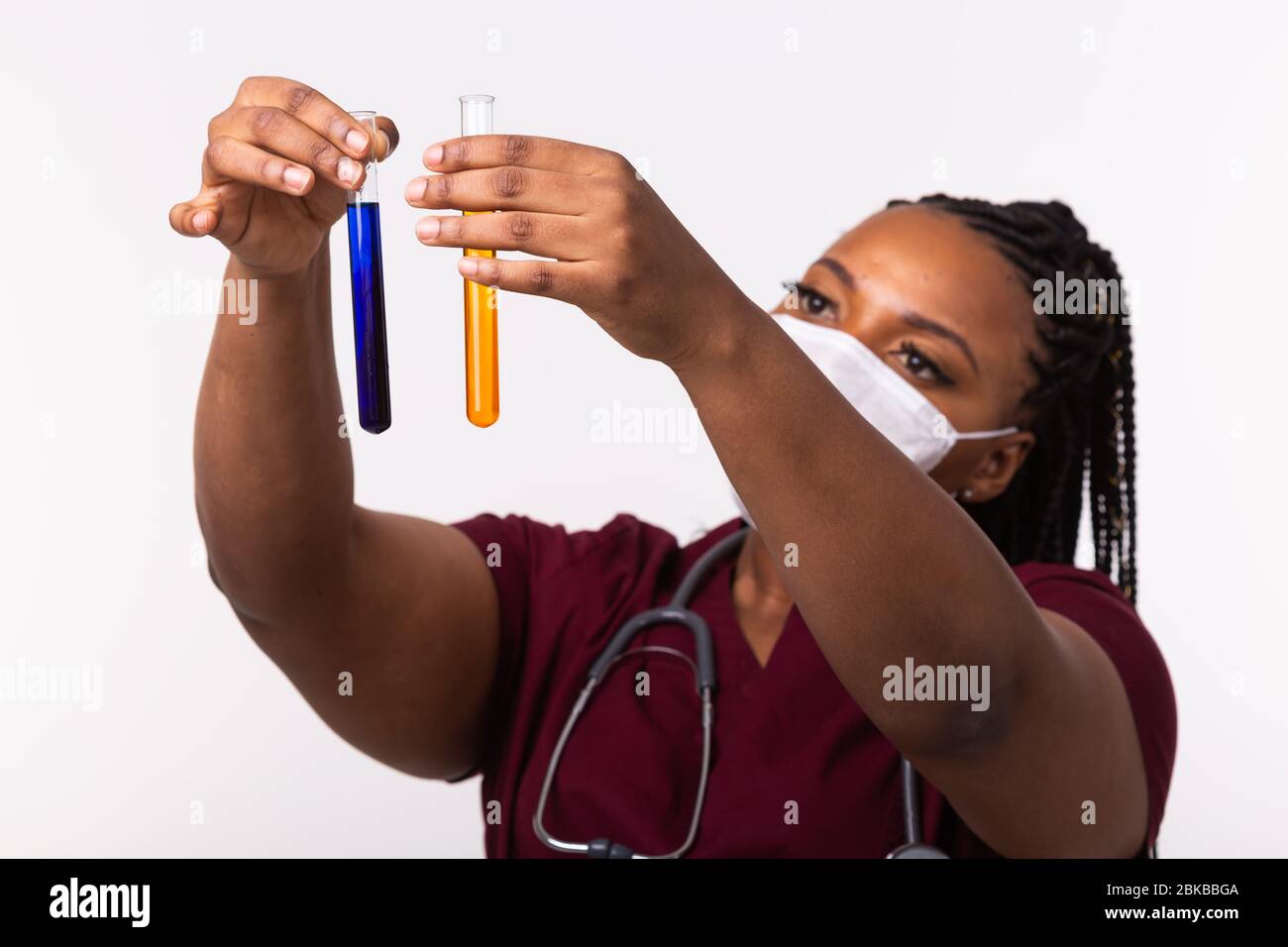 Glass tubes with fluids in nurse hand during medical test. Vaccine ...