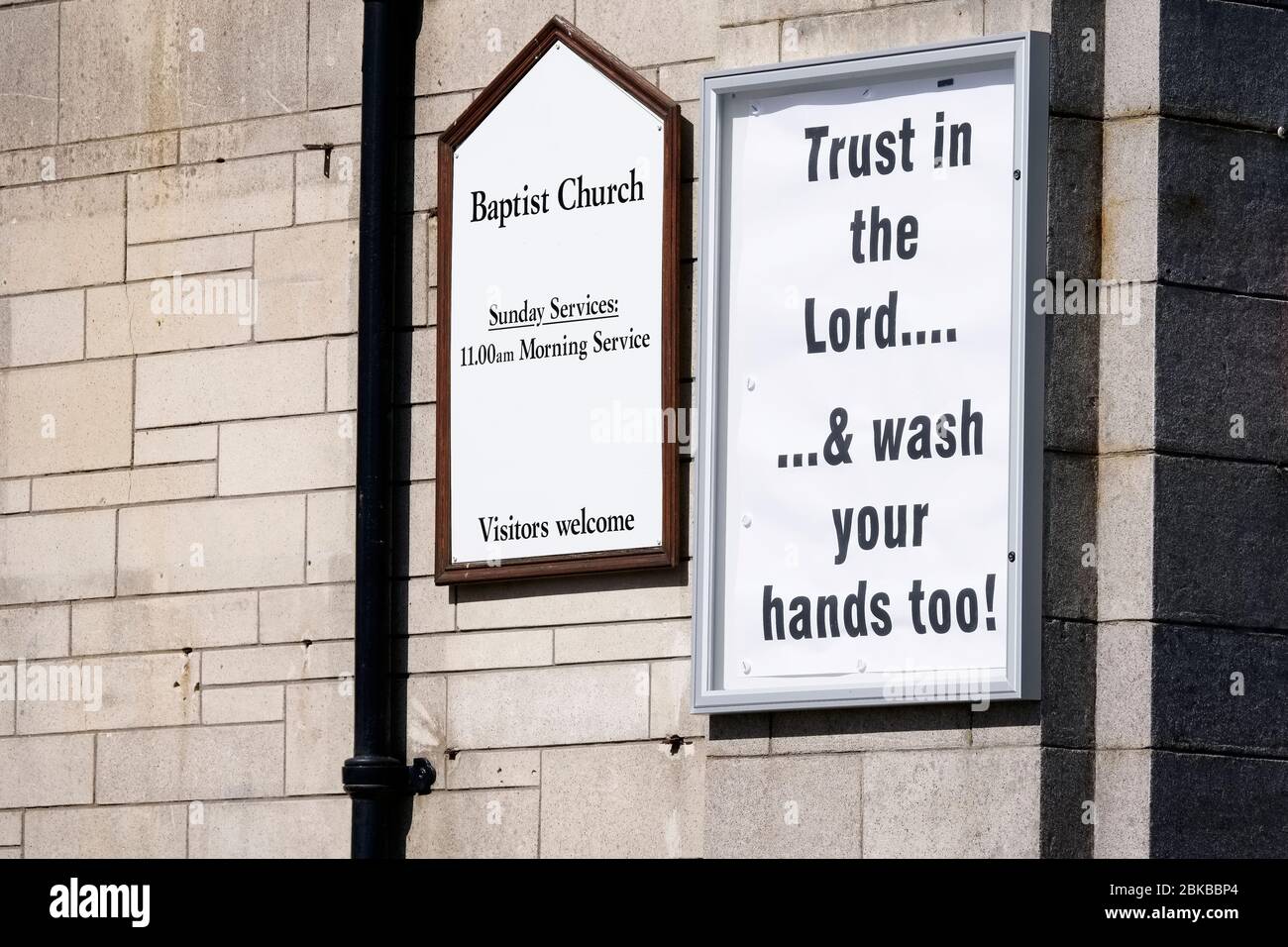 Wash hands message on religious church sign Stock Photo - Alamy