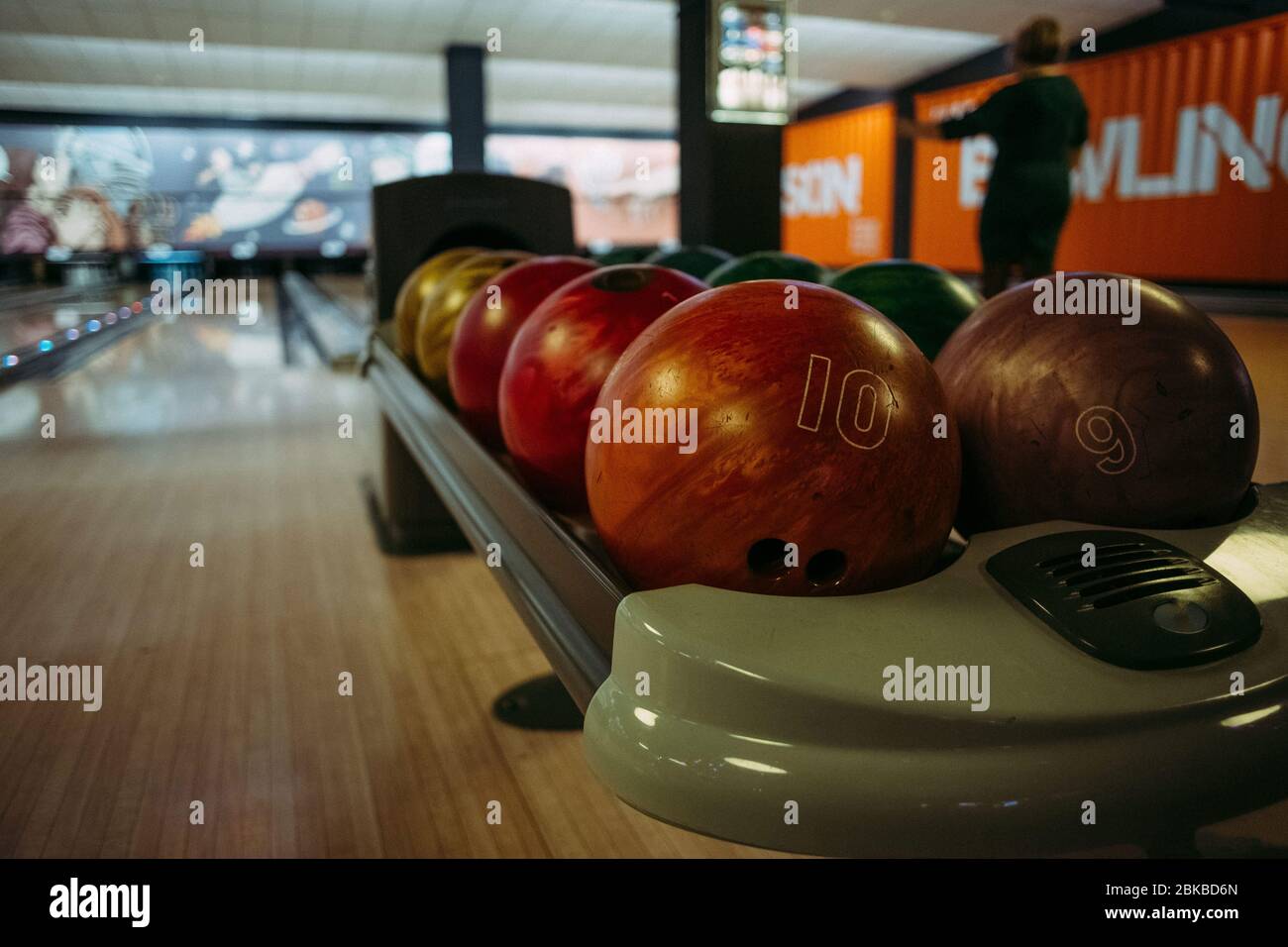 multi-colored bowling balls on the background of the tracks Stock Photo ...