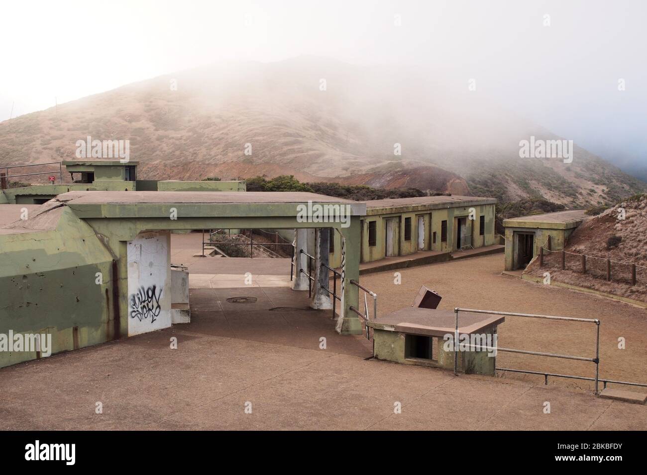 Old military buildings at Battery Spencer in fog, San Francisco ...