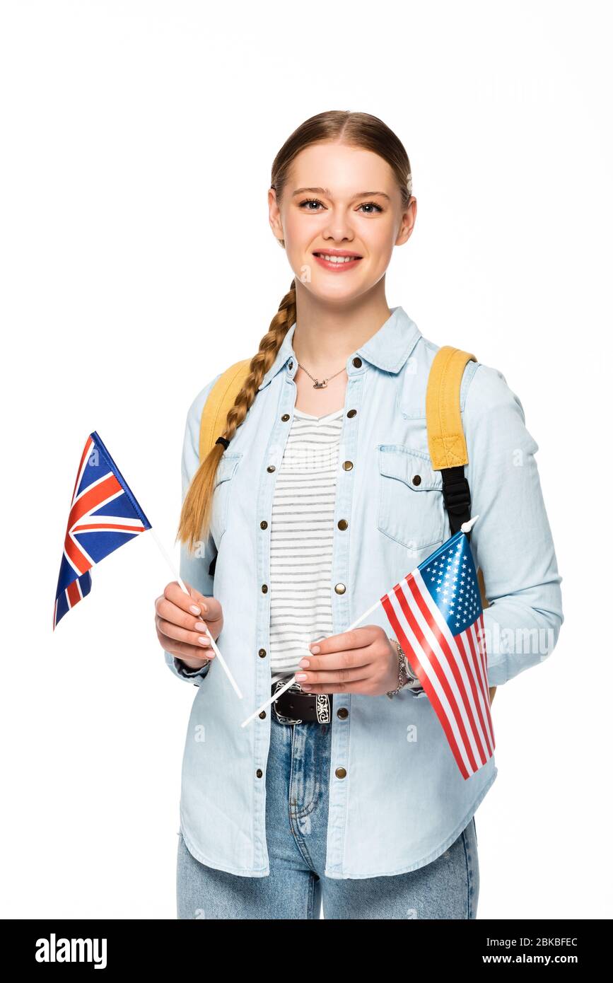smiling girl with braid and backpack holding flags of america and ...