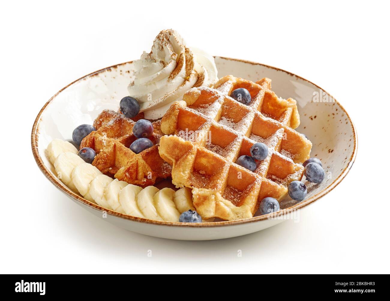 belgian waffle dessert decorated with cream and fruits isolated on ...