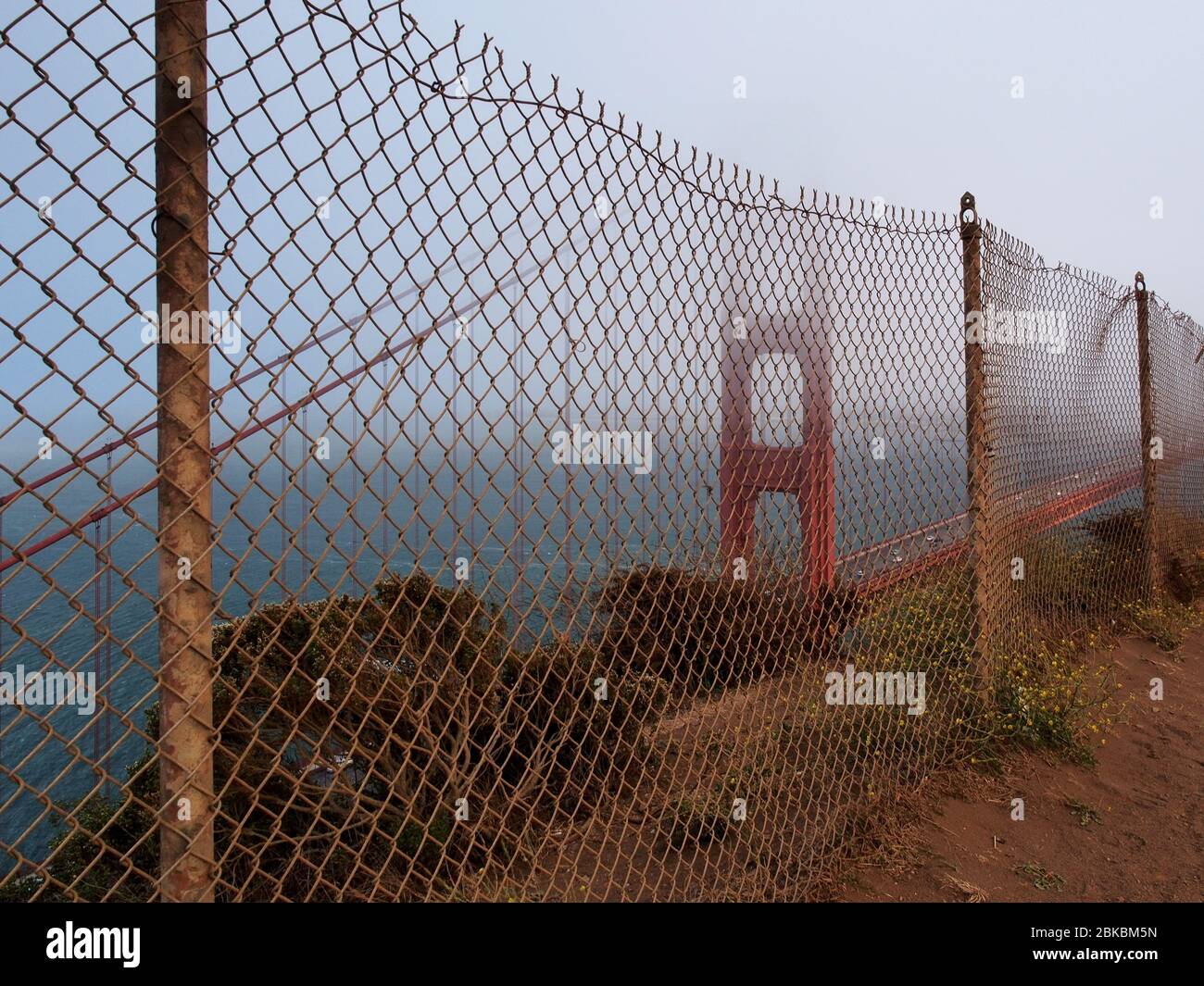 Golden gate bridge behind fence, San Francisco Stock Photo - Alamy