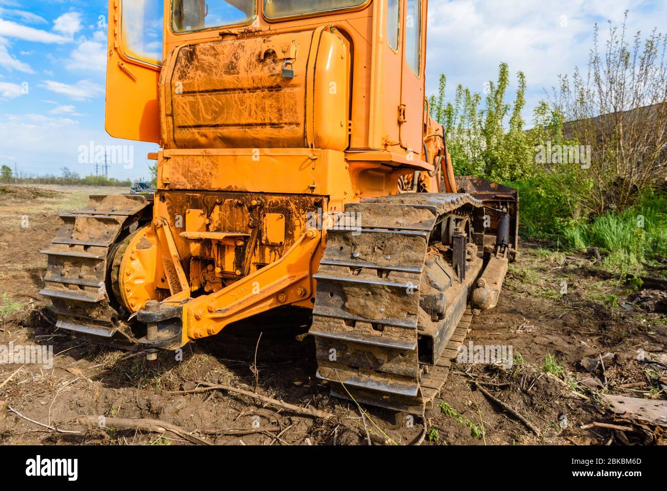 Industrial building construction site bulldozer leveling and moving ...
