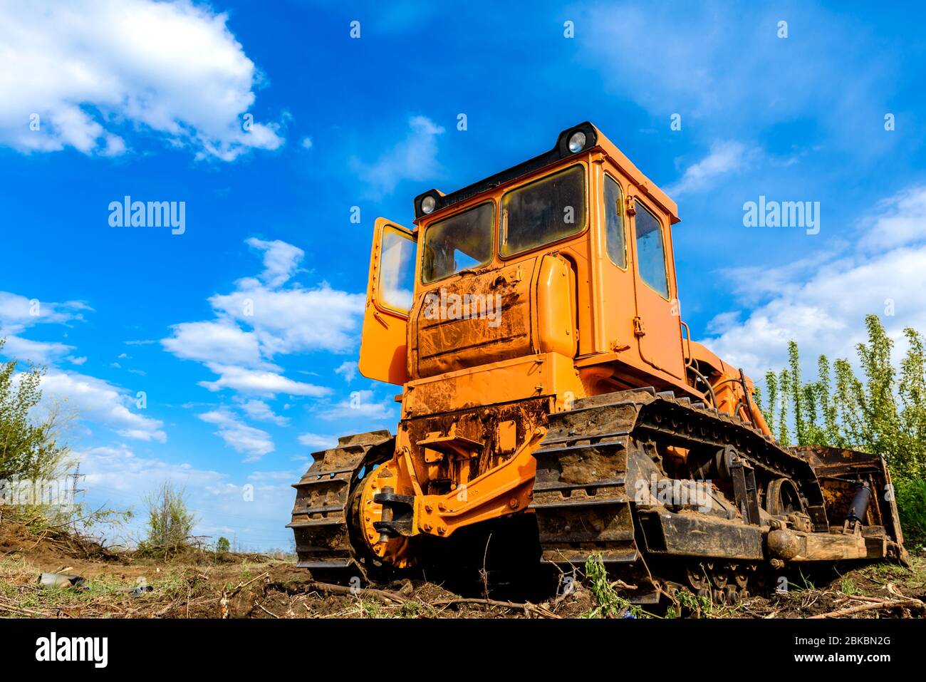 Industrial building construction site bulldozer leveling and moving ...
