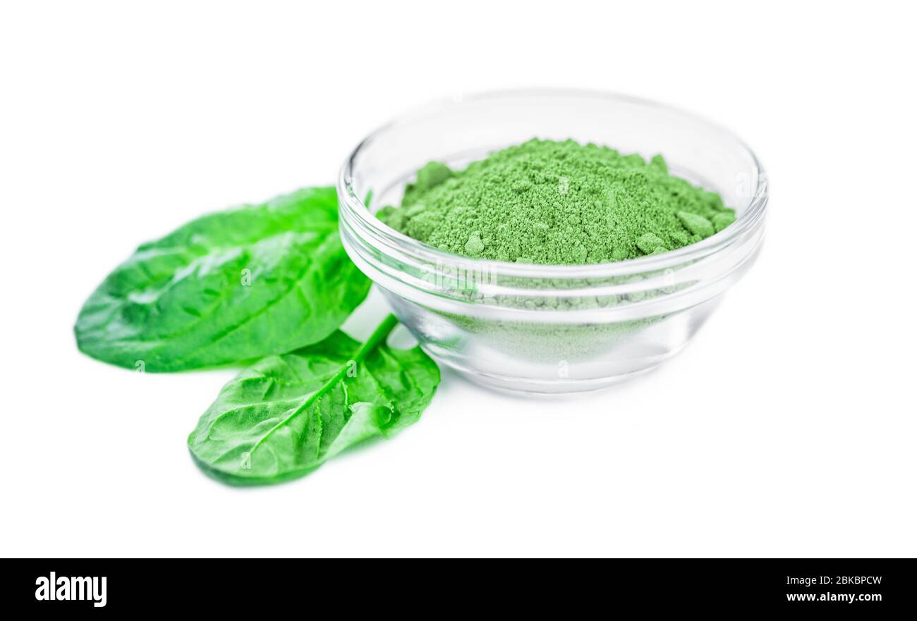 Spinach powder isolated on white background (close up; selective focus ...