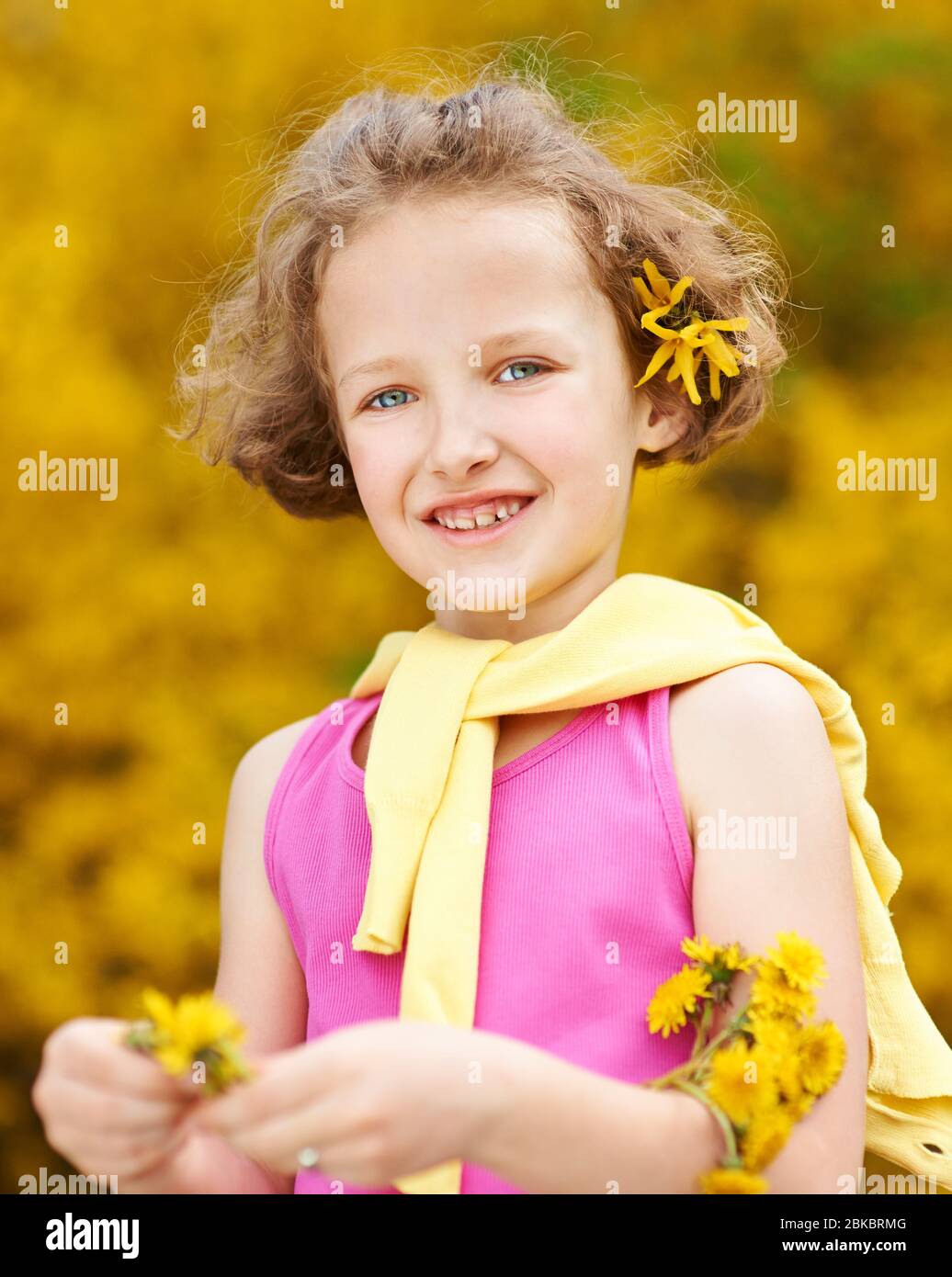 Child girl dandelions in hi-res stock photography and images - Alamy