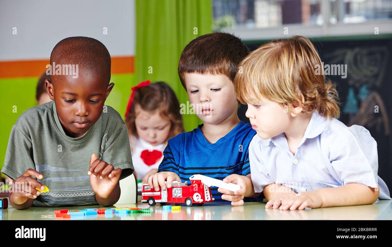 Children play together hi-res stock photography and images - Alamy