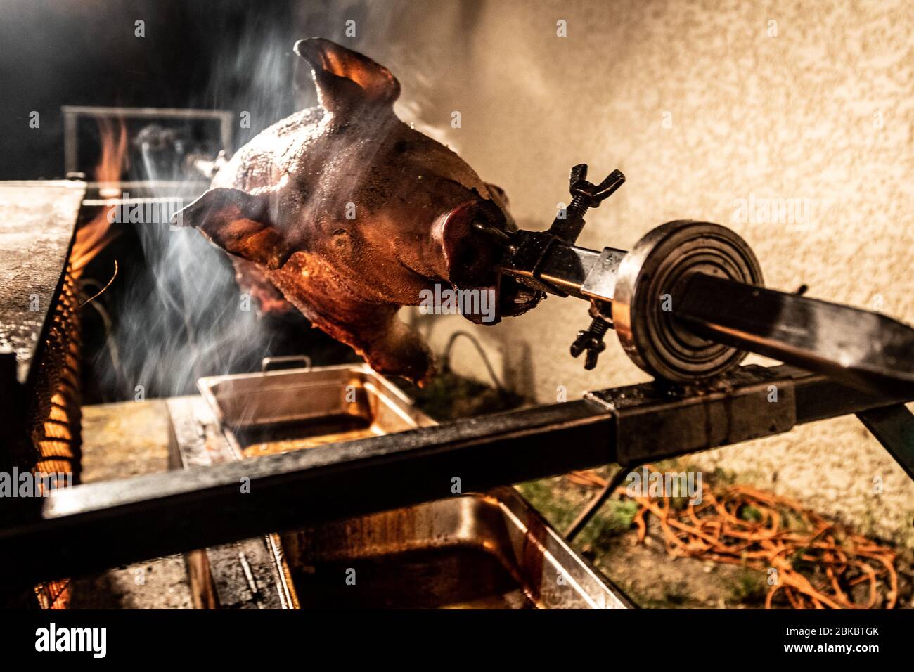 A grilled pig during a party Stock Photo - Alamy
