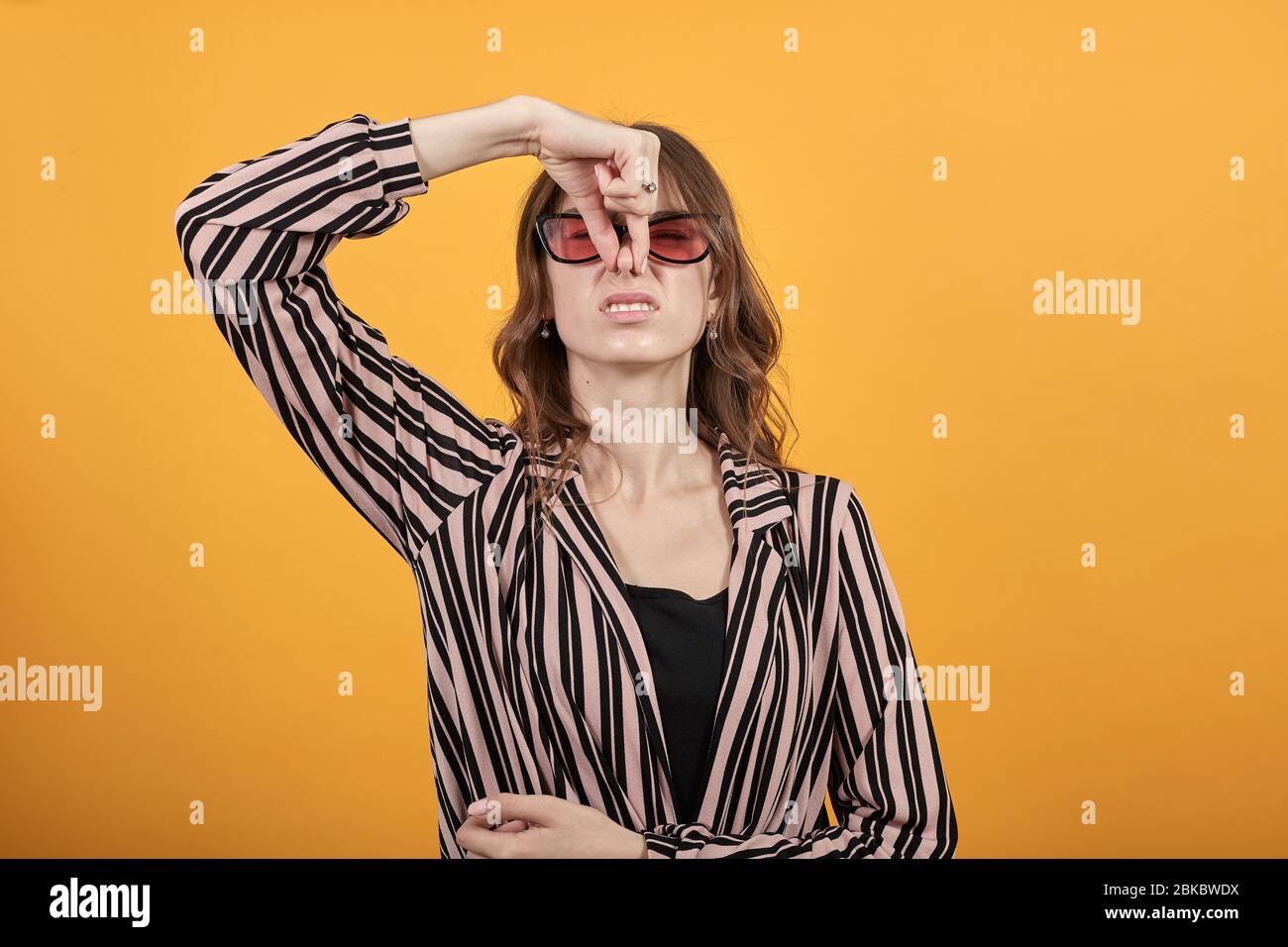 Girl Disgust Contorts Face Because Of Bad Smell, Stench, Covers Nose ...