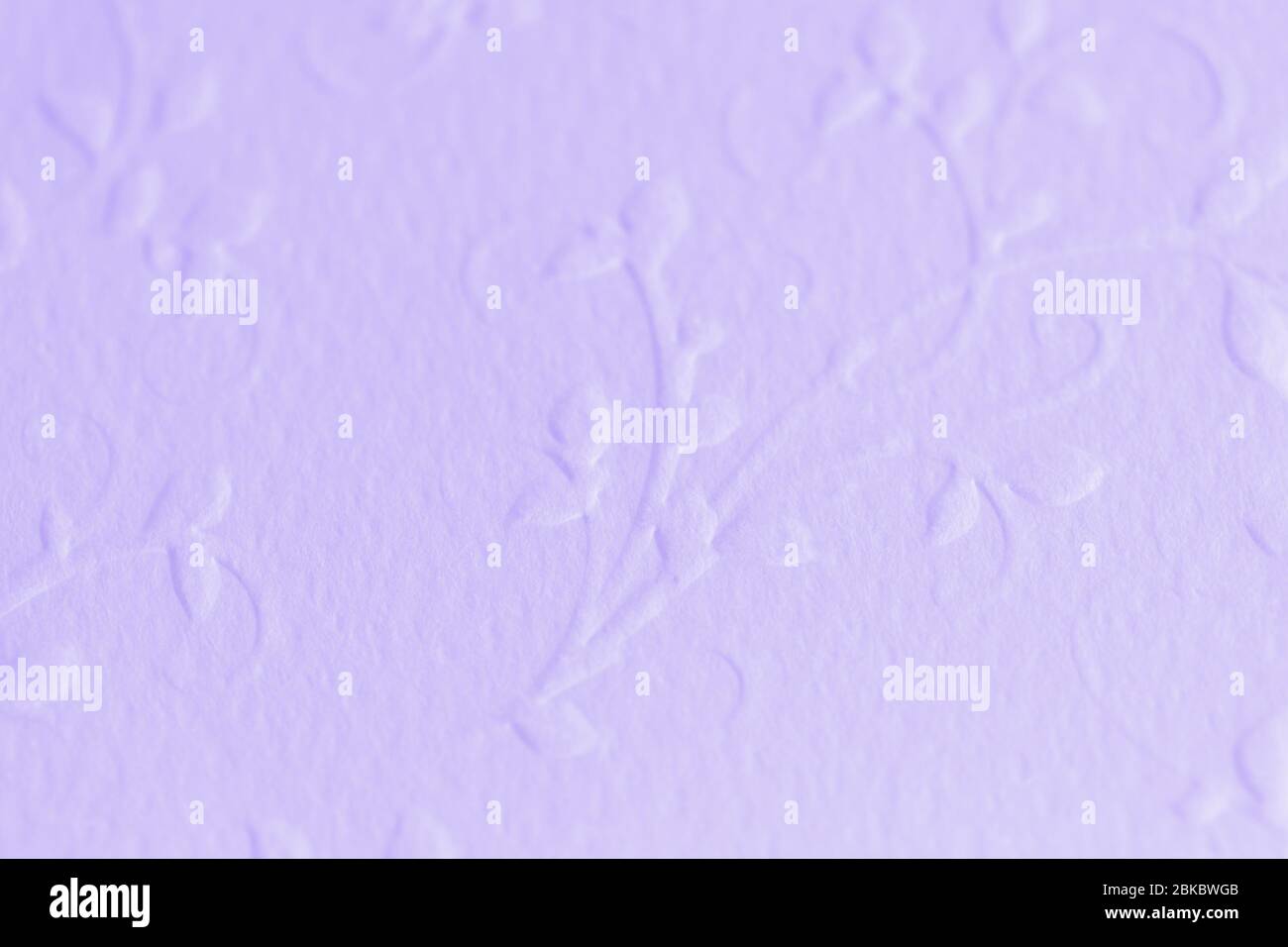 Light violet paper with embossed flowers pattern Stock Photo - Alamy