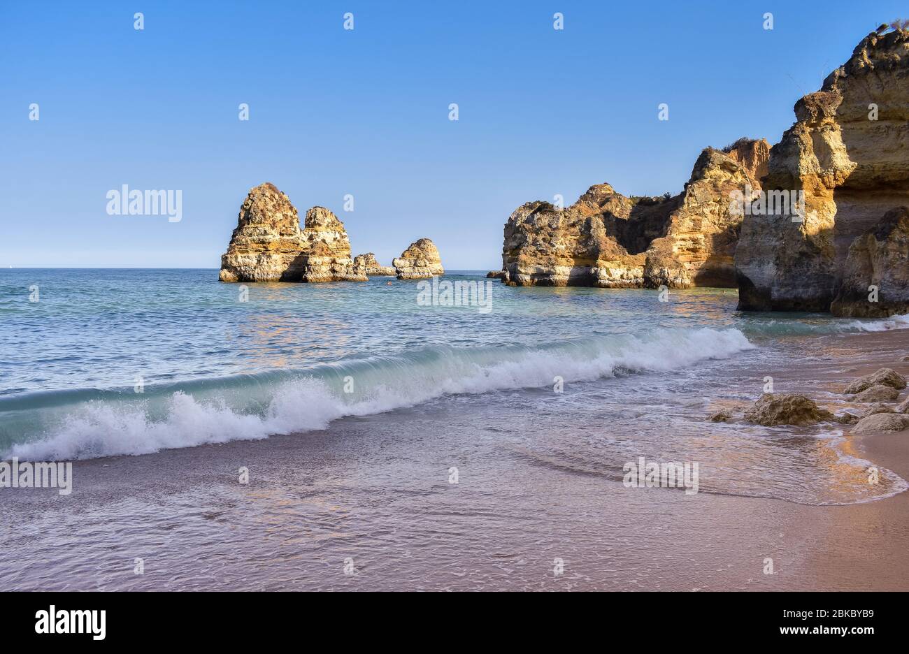 Cliffs of Pinhao Beach. View from below of the waves and empty sand at ...