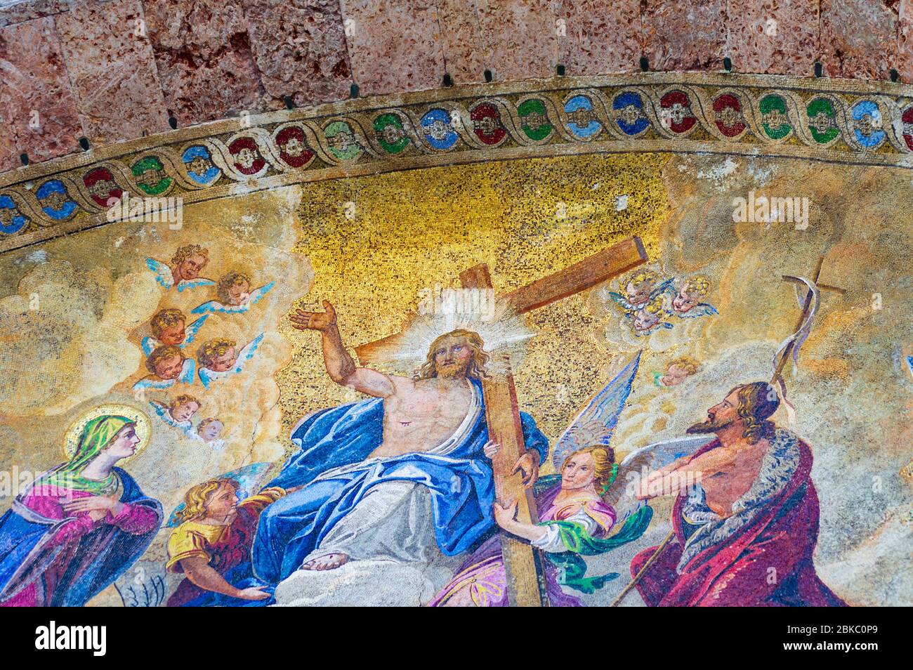 Mosaic at St. Mark Basilica facade over the main entrance depicting the ...