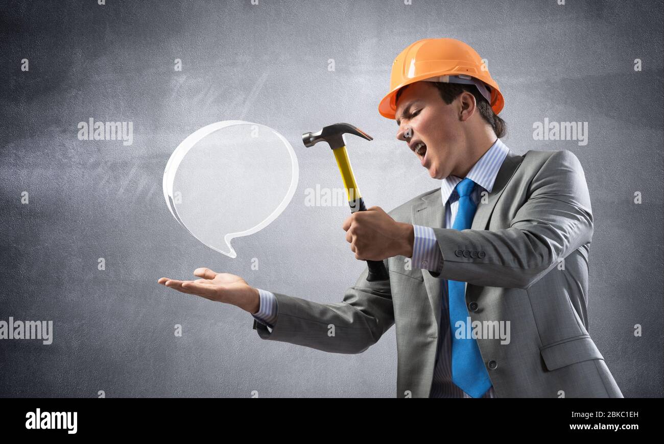 Furious businessman going to crash speech bubble Stock Photo - Alamy