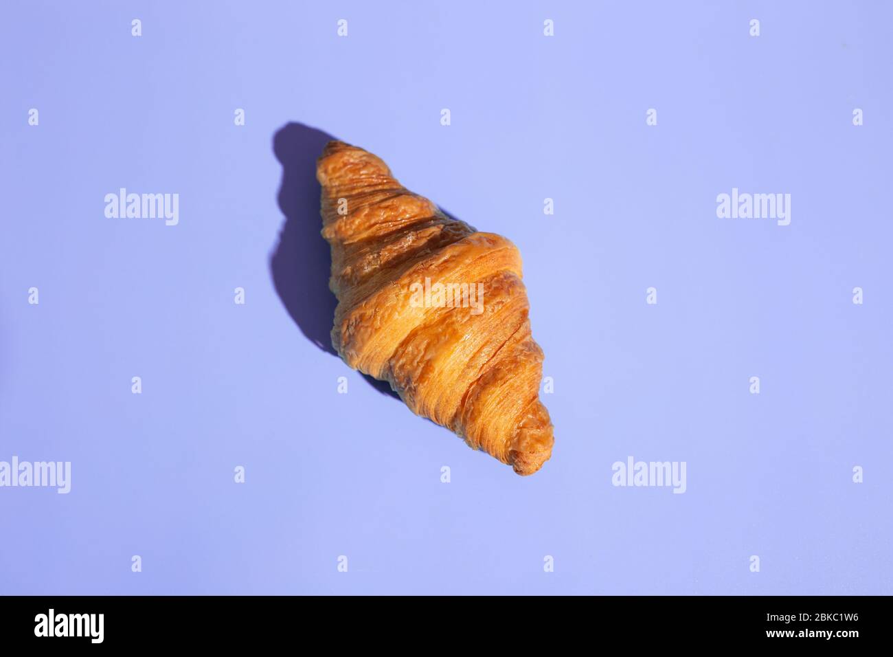 Bakery products baked croissant. Purple background, top view. Pop art ...