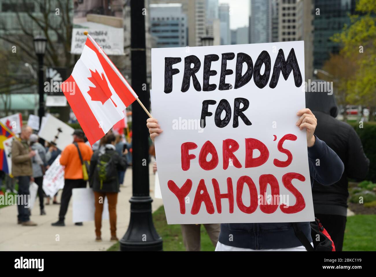 Protesters gather outside of the Ontario Legislative Building at Queen ...