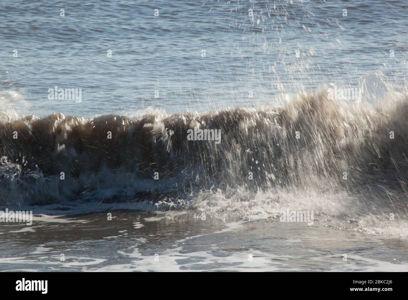 Ocean waves breaking at the beach Stock Photo - Alamy
